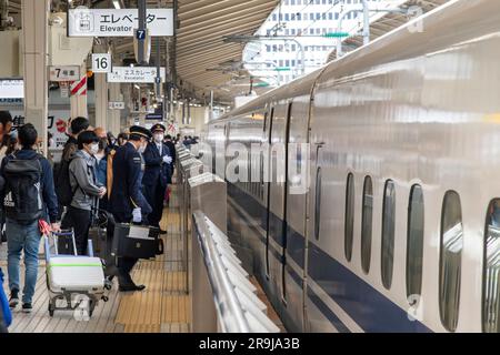 Shinkansen bullet train platforms April 2023, passengers wait to board high speed bullet train ...