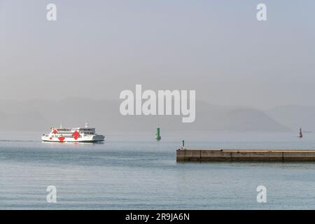 Naoshima Island, Japan-April 2023; View of ferry approaching Miyanoura ...