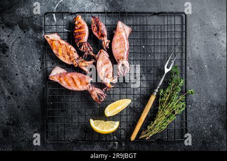 Bbq squid calamary on a rack. Isolated, white background Stock Photo ...