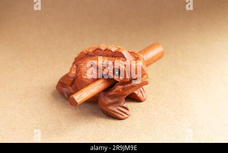 Wooden musical instrument toad percussion on white background Stock ...