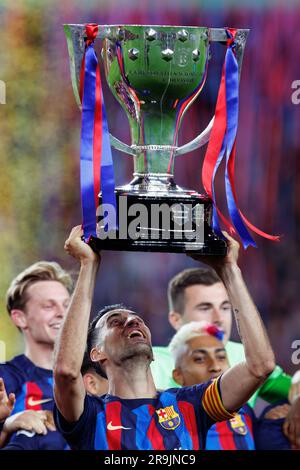 Sergio Busquets of FC Barcelona with the winner's trophy during the ...