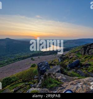 The photo shows a sunset at Bamford Edge in the Peak District. The sky ...
