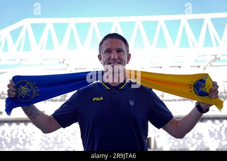 Former Ireland soccer great Robbie Keane poses for photographers in Tel ...