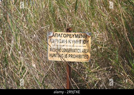 Sign in Greek and English saying Wildlife Conservation Area Hunting is ...