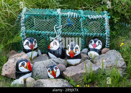 Seaside art. Hand painted puffins and a lobster creel in a garden at ...