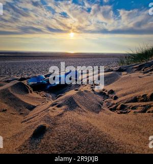 Breathtaking sunset at Formby Beach, where nature paints the sky with a ...