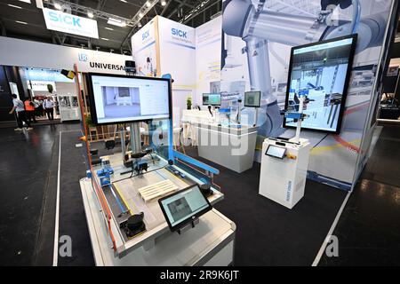 Munich, Germany. 27th June, 2023. Setups at SICK's booth can be seen at ...