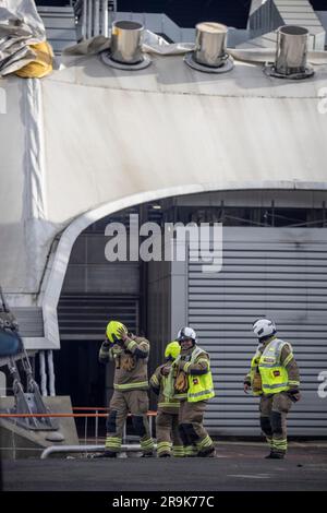 Fireman attend the scene at O2 Arena in East London where the tarpaulin ...