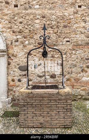 ancient medieval well in the Scaliger Castle of the medieval town ...