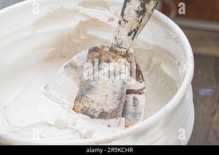 Working with sparkle wall compound spatula human hand construction ...