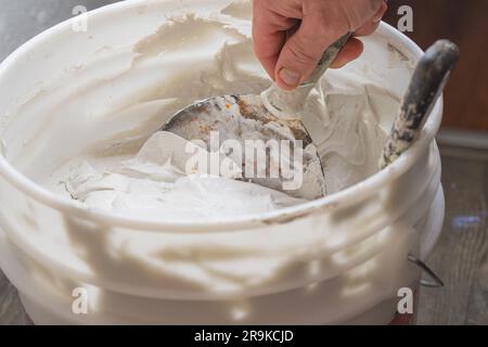 Working with sparkle wall compound spatula human hand construction ...
