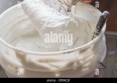 Working with sparkle wall compound spatula human hand construction ...