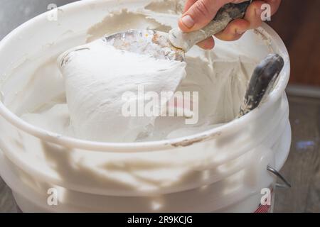 Working with sparkle wall compound spatula human hand construction ...