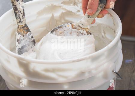 Working with sparkle wall compound spatula human hand construction ...