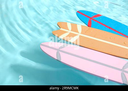 Different colorful mini surfboards in water Stock Photo - Alamy