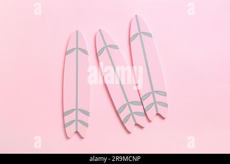 Mini surfboards on pink background Stock Photo - Alamy