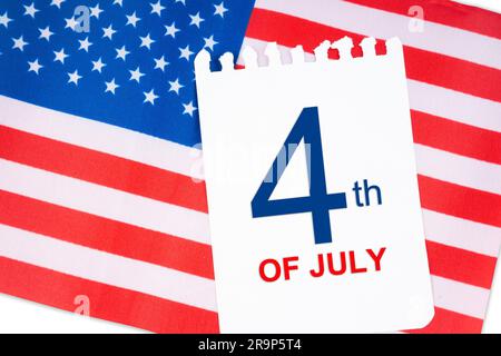 4 th July calendar with part of an American flag on white background ...