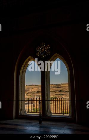 arched upper windows where the natural landscape outside can be ...