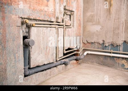 Transfer of water pipes and sewerage drain in the wall. Bathroom ...