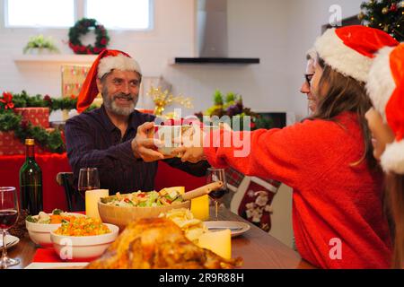 happy family with christmas gift at home Stock Photo - Alamy