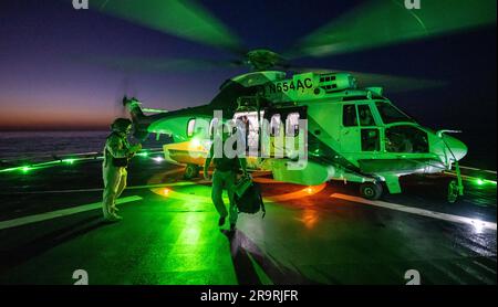 Support teams arrive via helicopter to the SpaceX recovery ship Shannon ...
