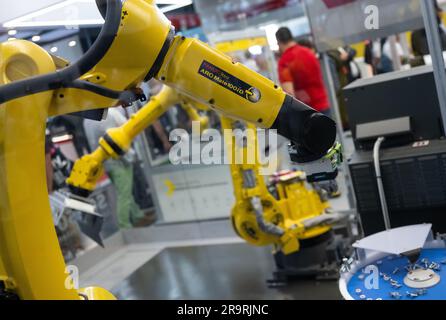 Munich, Germany. 28th June, 2023. A robot arm from ABB is on display at ...