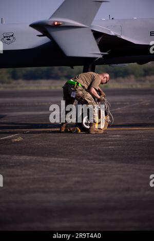 Airmen assigned to the 163d Attack Wing board a C-17 aircraft assigned ...