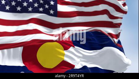 The Colorado state flag waving with the national flag of the US on a ...