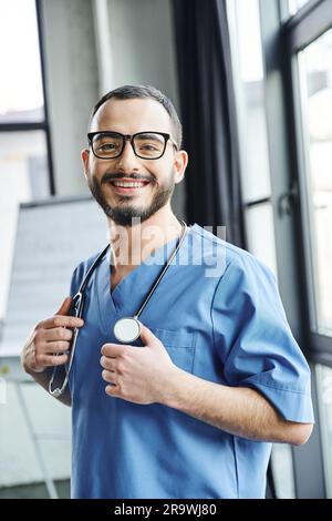 first aid training seminar, smiling asian woman with pen and clipboard ...
