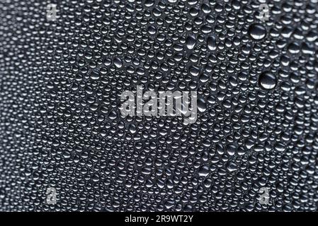 Many little water drops due to condensation on a plastic bottle curved ...