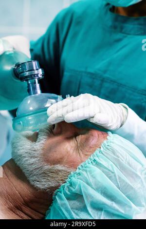 Anesthesiologist doctor anesthetized a surgical patient in hospital ...