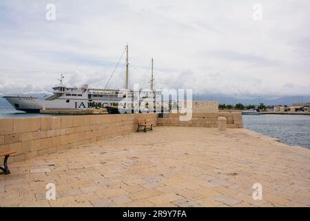 The harbour sign and ferry in Supetar port, Brac Island, Croatia. The ...