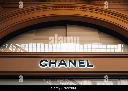 Classy aesthetic Chanel boutique entrance. Neutral beige stand with ...
