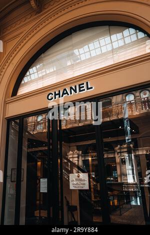 Classy aesthetic Chanel boutique entrance. Neutral beige stand with ...