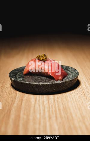 three styles fatty tuna sushi, akami, chuoro, otoro, with golden leaf ...