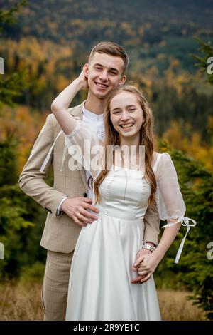 happy young bride on autumn forest background Stock Photo - Alamy