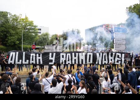 People hold a sign Allah y rahmo Nahel (may he rest in peace Nahel ...