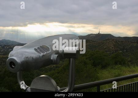 Telescope viewer with the distant Hollywood sign from the Griffith ...