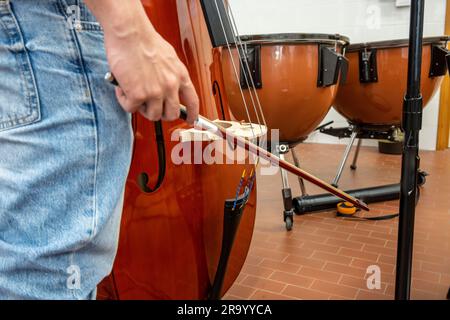 Real life young music students during rehearsals. Musical instruments ...