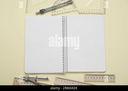 Flat lay composition with different rulers and compass on pink ...