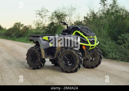 Modern fast quad bike on pathway outdoors Stock Photo - Alamy
