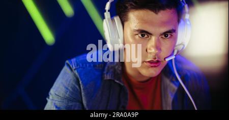 Esports, gamer and man online at night in competition battle or virtual ...