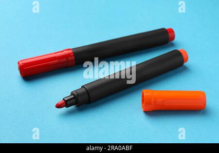 Bright color markers on light grey background, flat lay. Space for text ...
