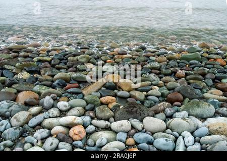 Closeup of colorful rounded rocks and ocean, Lima, Peru Stock Photo - Alamy