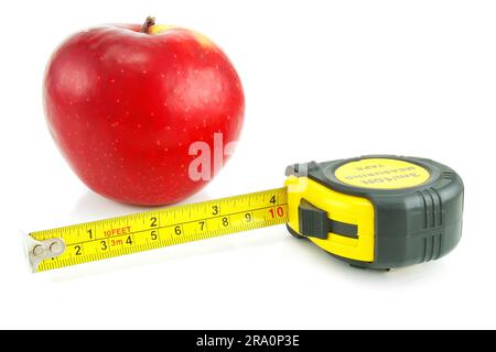 Bright red apple and measuring tape isolated on a white background ...