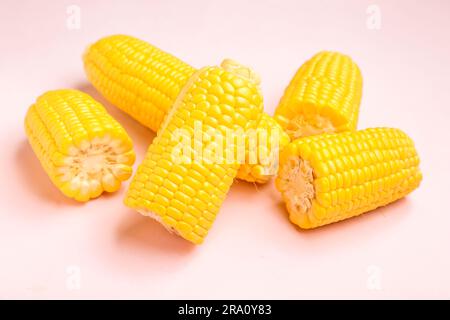 Fresh corn cobs on pink background Stock Photo - Alamy
