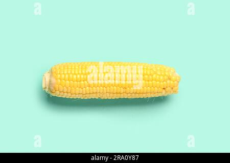 Fresh corn cob on turquoise background Stock Photo - Alamy