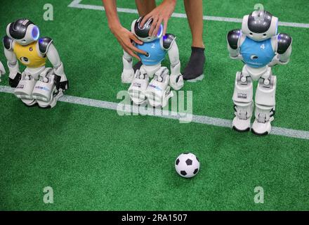 Leipzig, Germany. 28th June, 2023. Nao robots play soccer during a training game in a laboratory ...