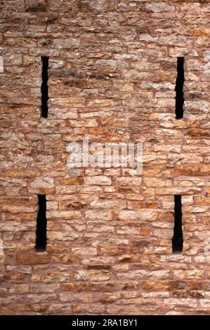 Arrow slits in stone wall Stock Photo - Alamy