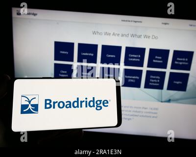 Logo of public company Broadridge Financial Solutions displayed on a ...
